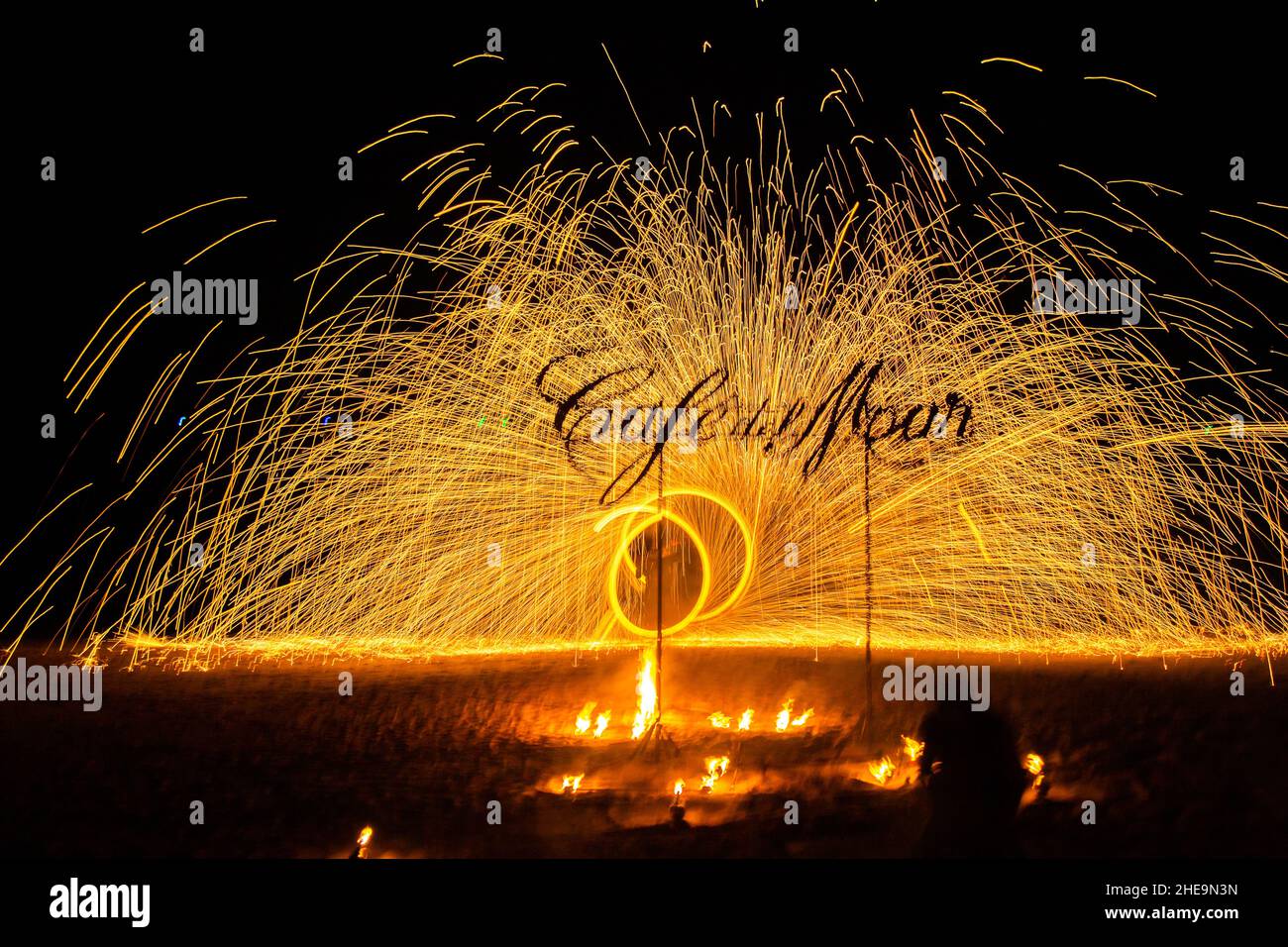 Fire show on the beach at night in Phuket, Thailand Stock Photo - Alamy
