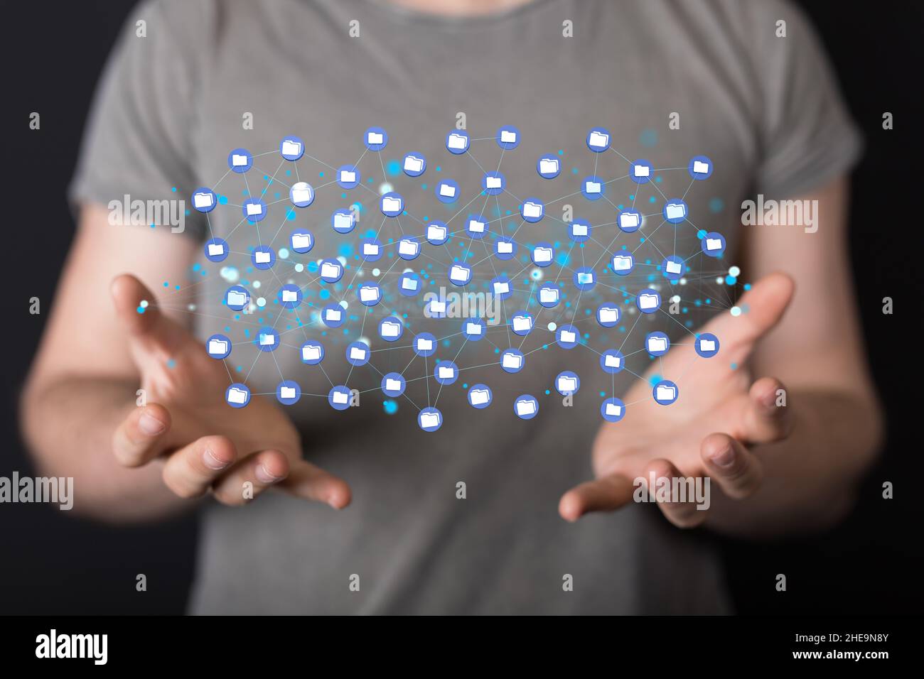 Shallow focus of human hands holding linking icons for data network ...