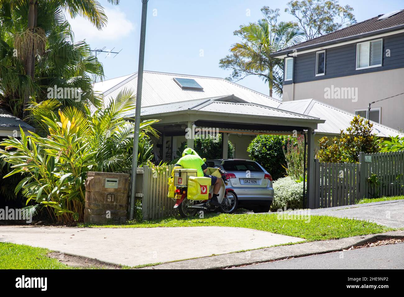 Australia Post postman riding motorbike delivers mail and letters to ...