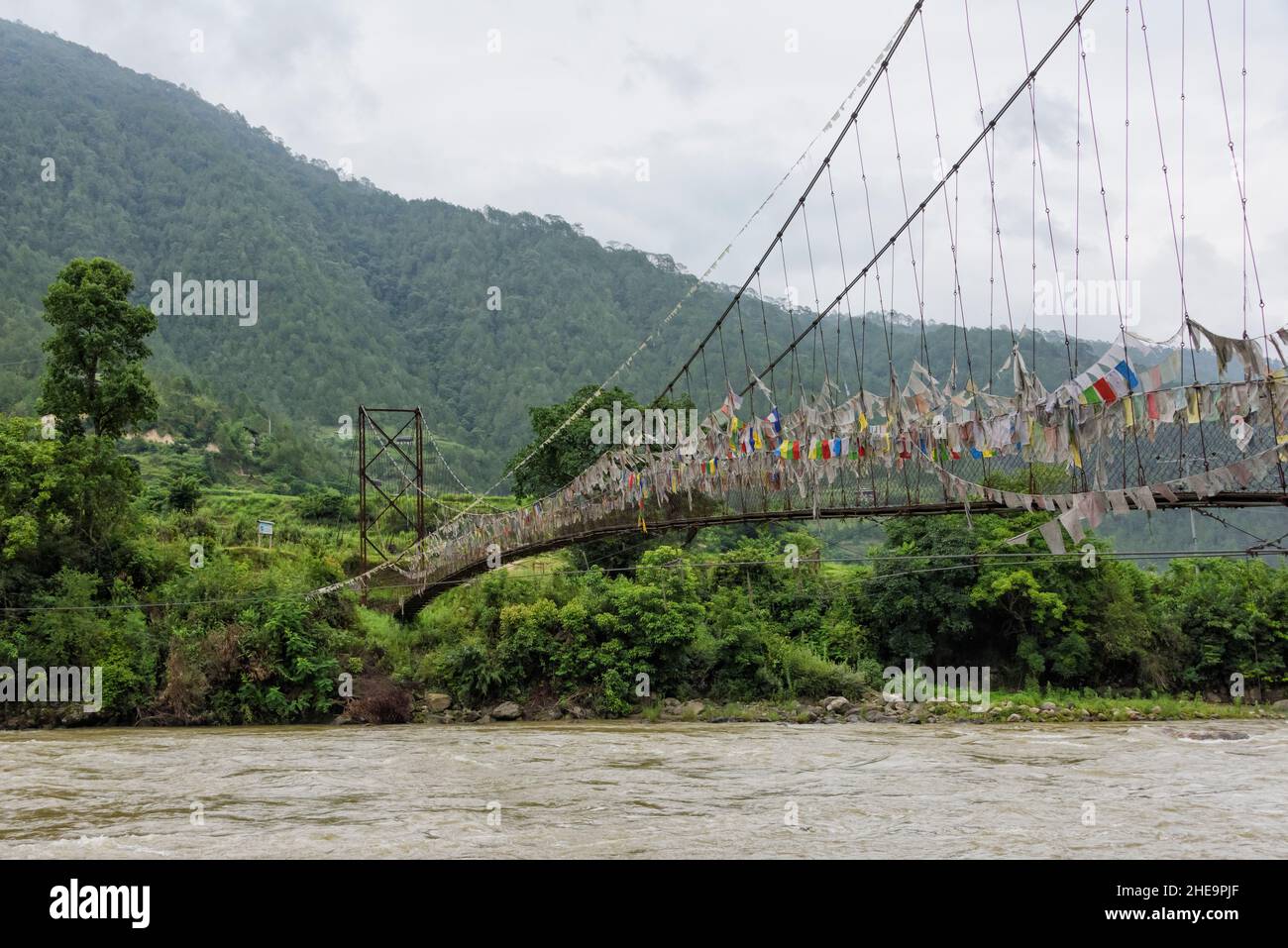 Iron bridge across the river in the Himalayas, Punakha, Bhutan Stock ...
