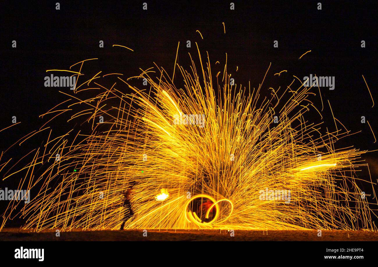 Fire show on the beach at night in Phuket, Thailand Stock Photo - Alamy