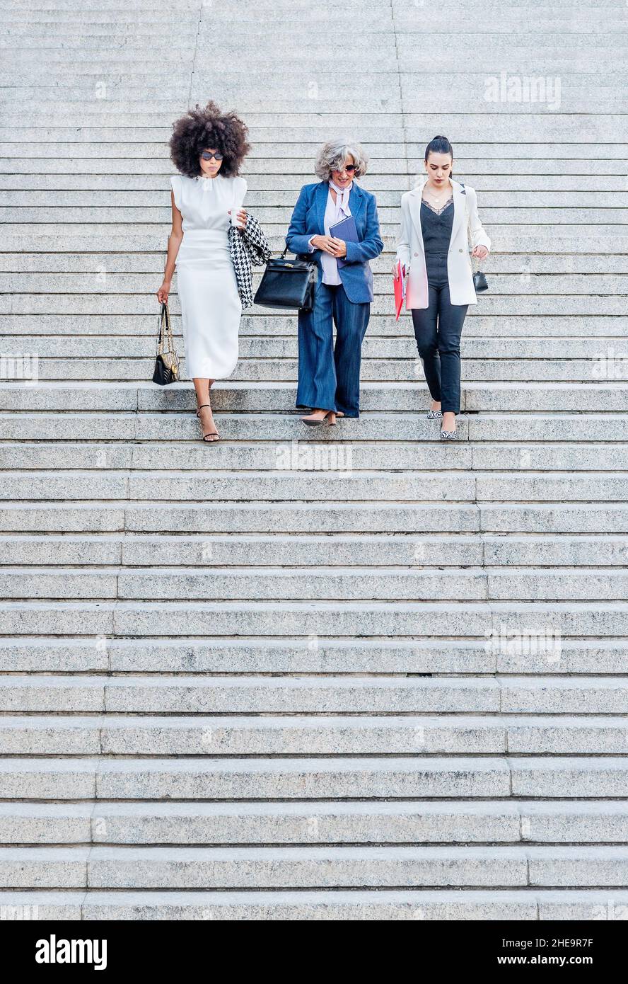 three female co-workers returning from work together Stock Photo - Alamy
