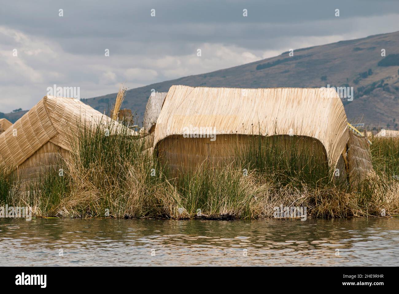 traditional huts made from dry reeds on famous floating Uros Islands at ...