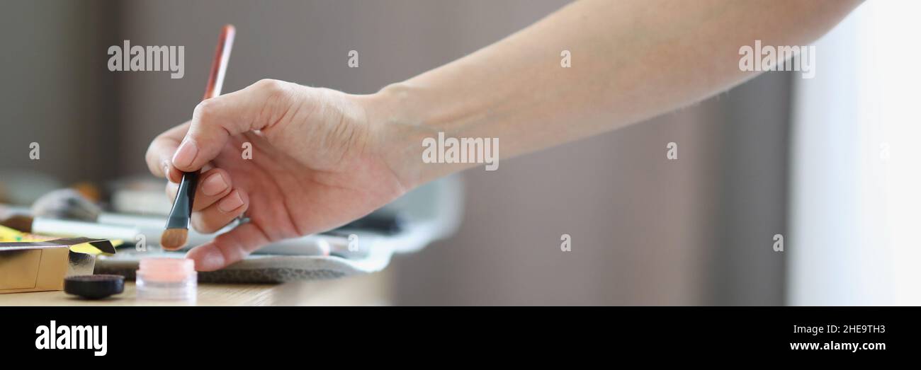 Adult holding natural tool Stock Photo - Alamy
