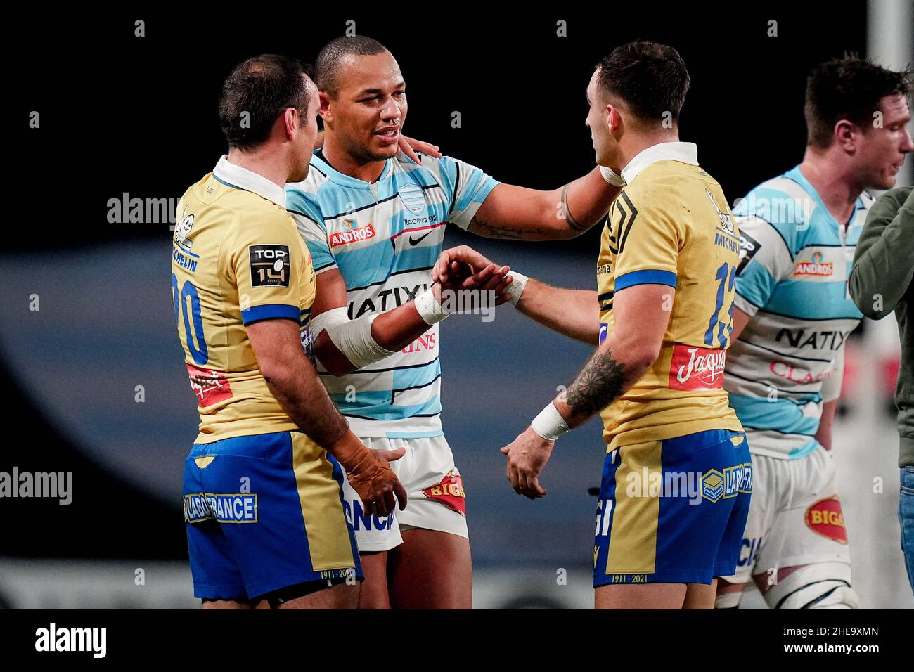 Morgan Parra and Jean Pascal Barraque of ASM with Gael Fickou of Racing ...