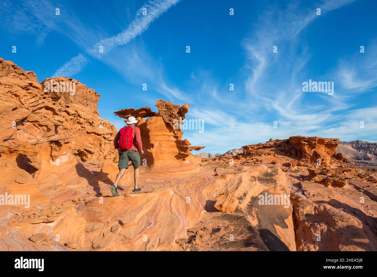 Hiker inside a stone arch in the Nevada desert near Las Vegas, Nevada ...
