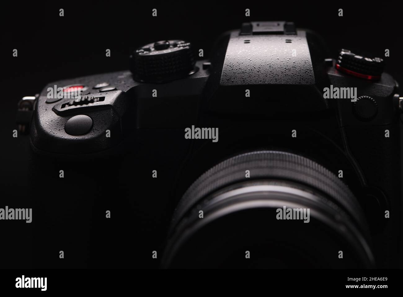 Digital stylish black camera on a black background, close-up Stock ...
