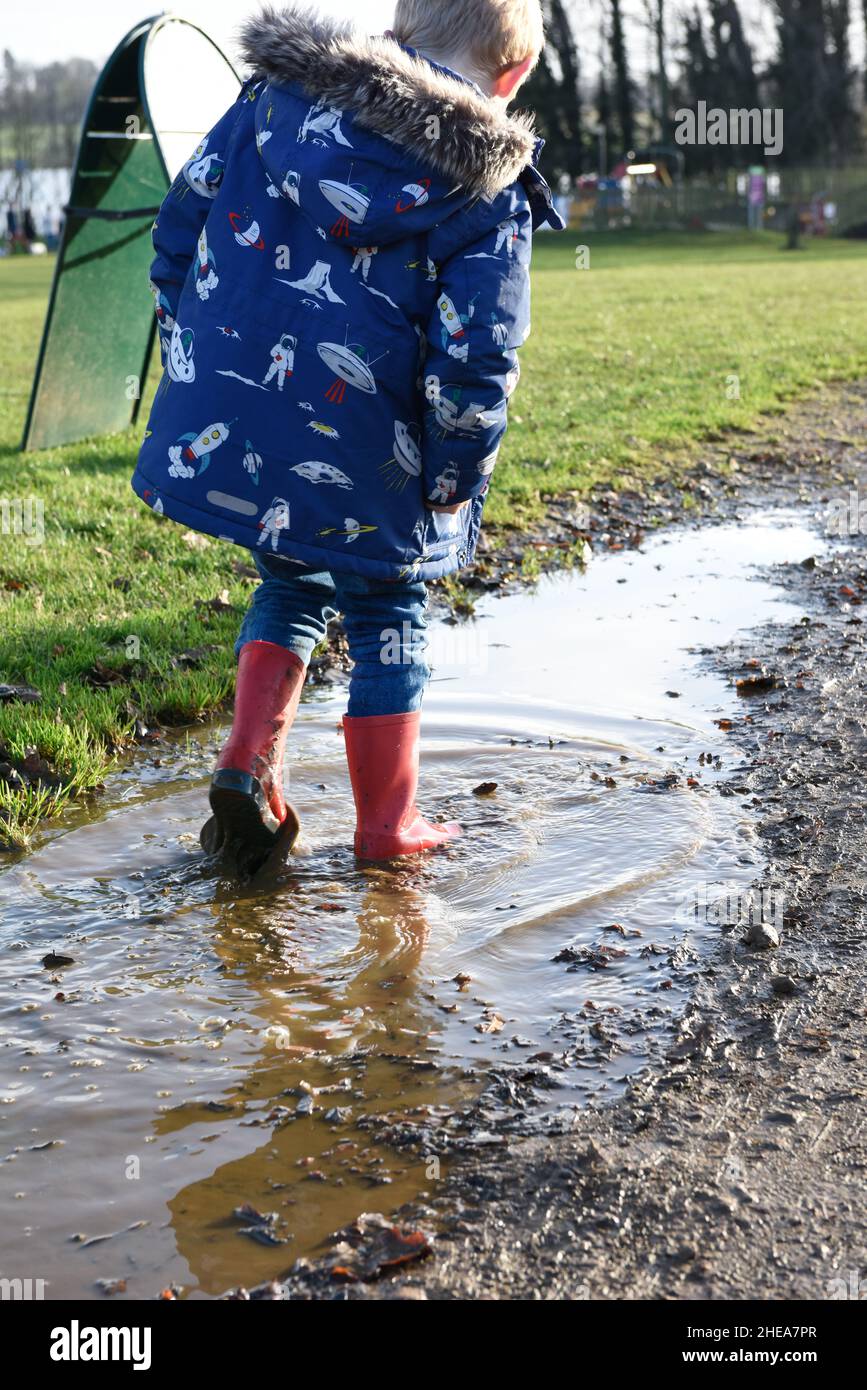 Welly boots muddy puddle hi-res stock photography and images - Alamy