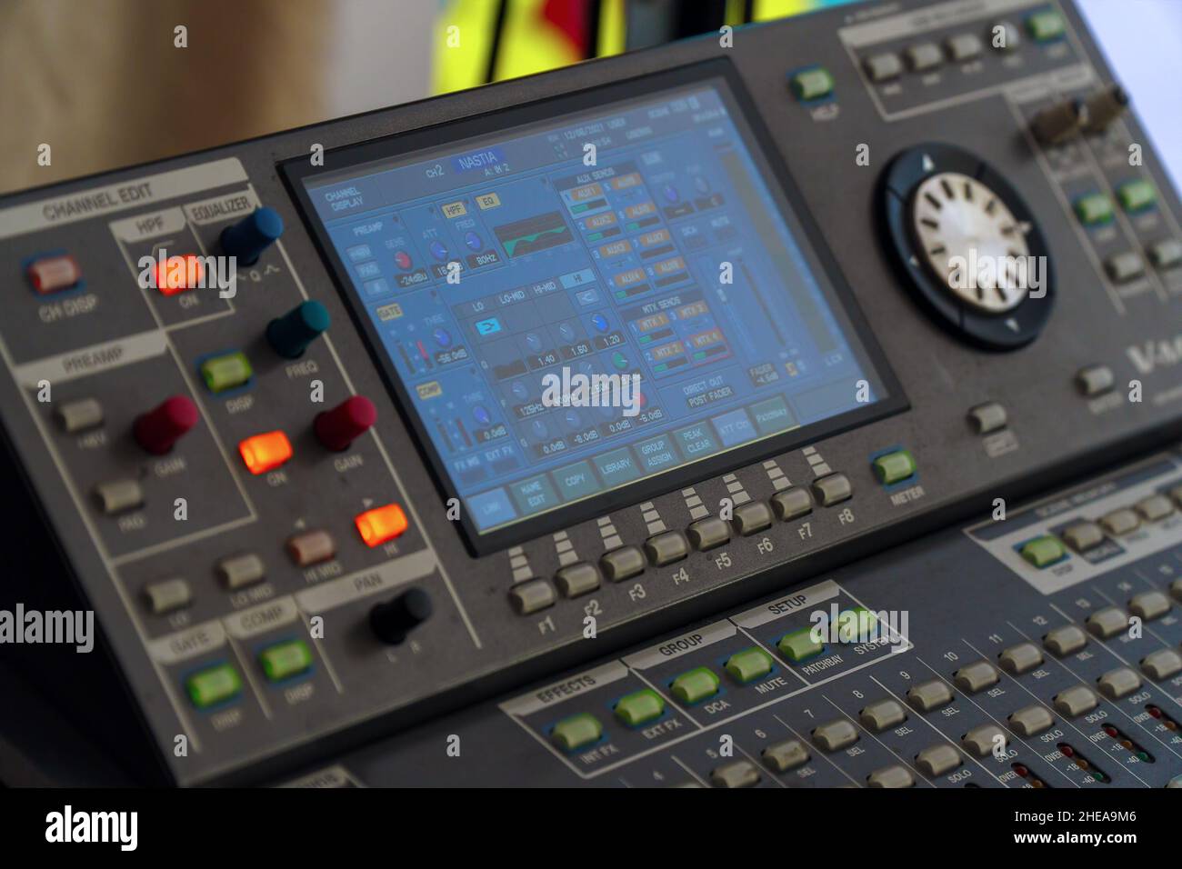 Modern digital mixing console with faders, control buttons and touch ...