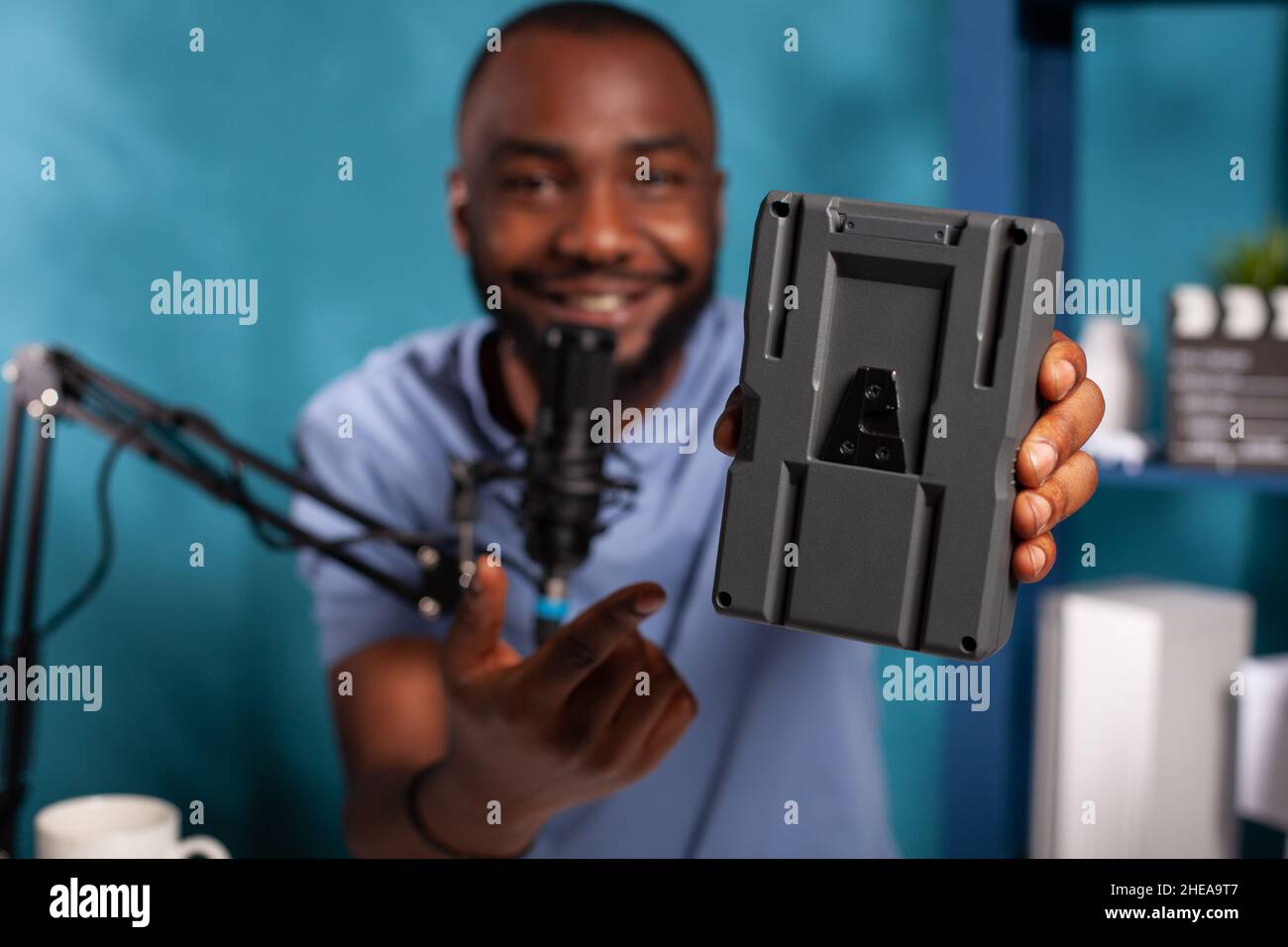 Selective focus on vlogger hand pointing index finger v mount ...