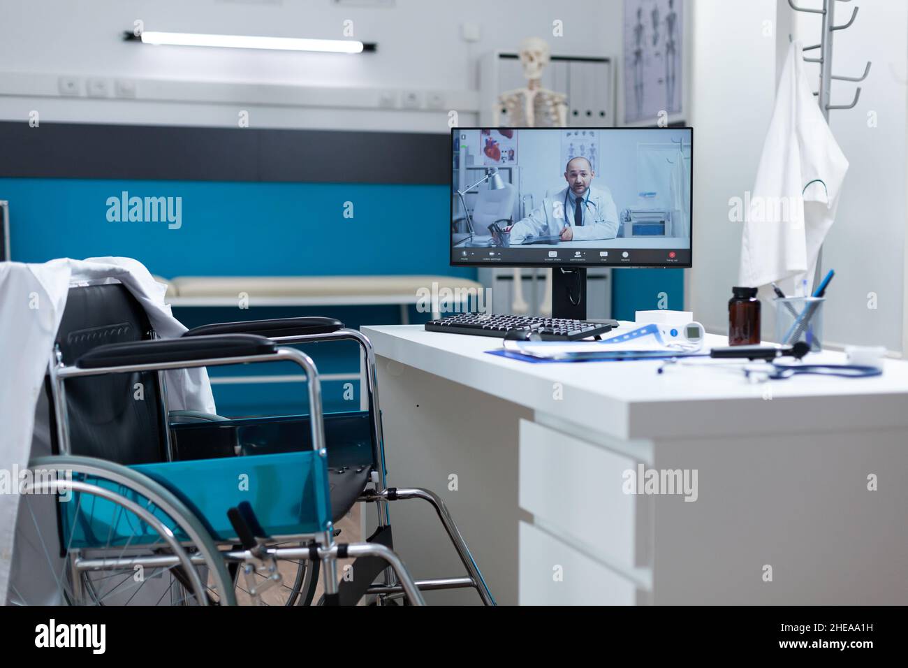 Computer screen with remote man doctor talking during online videocall ...