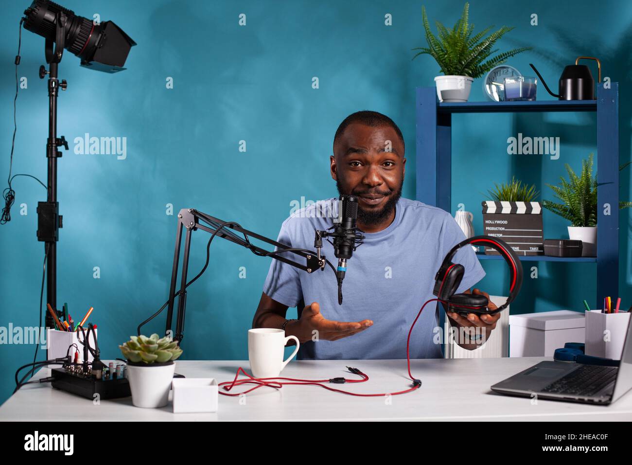 Social media influencer presenting professional gaming headset to ...