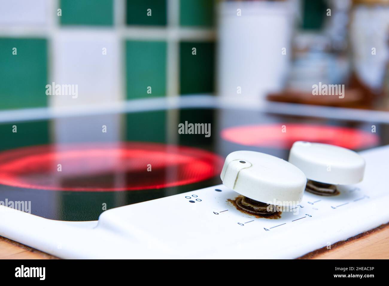 Electric hob in modern home kitchen interior with heat turned up high ...