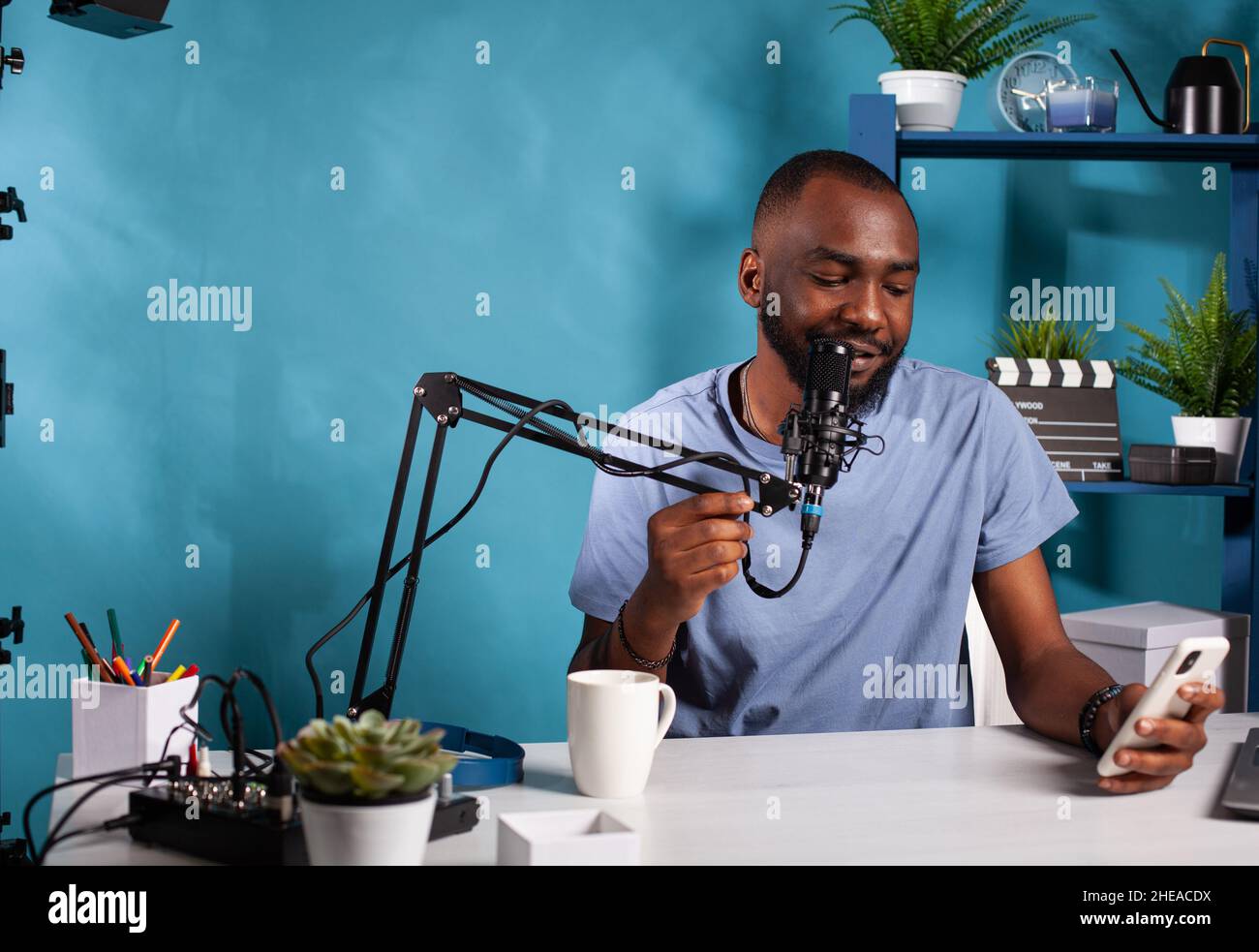 African american vlogger reading live text messages from fans looking ...