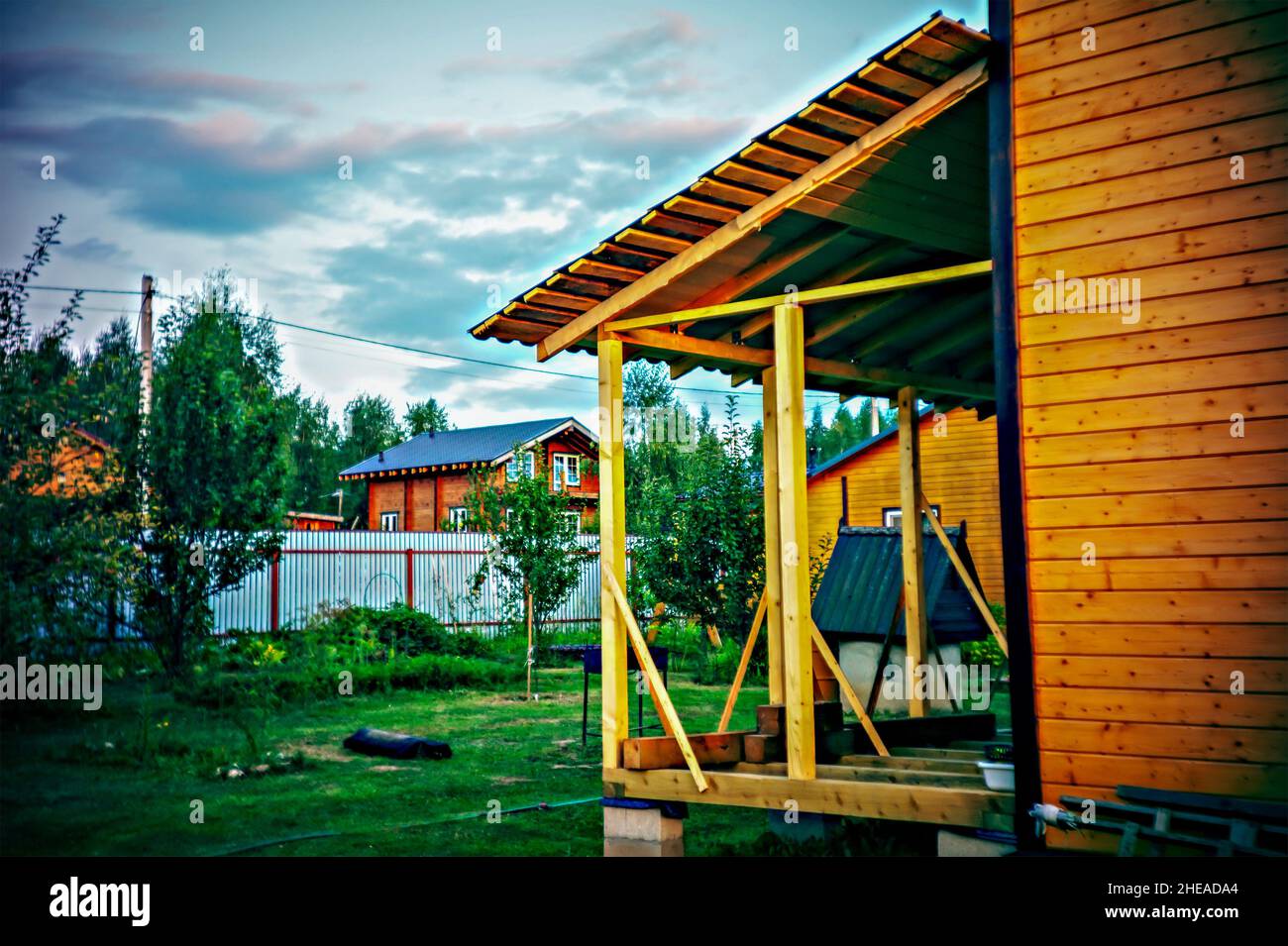 unfinished rural wooden house in summer, lomography Stock Photo - Alamy