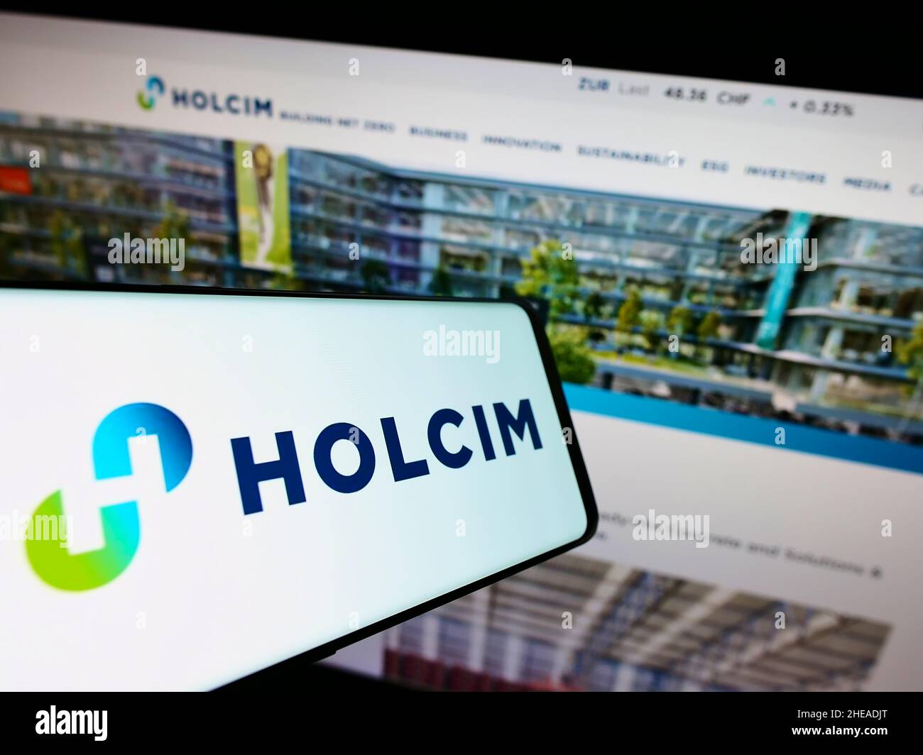 Smartphone with logo of Swiss building materials company Holcim Limited ...