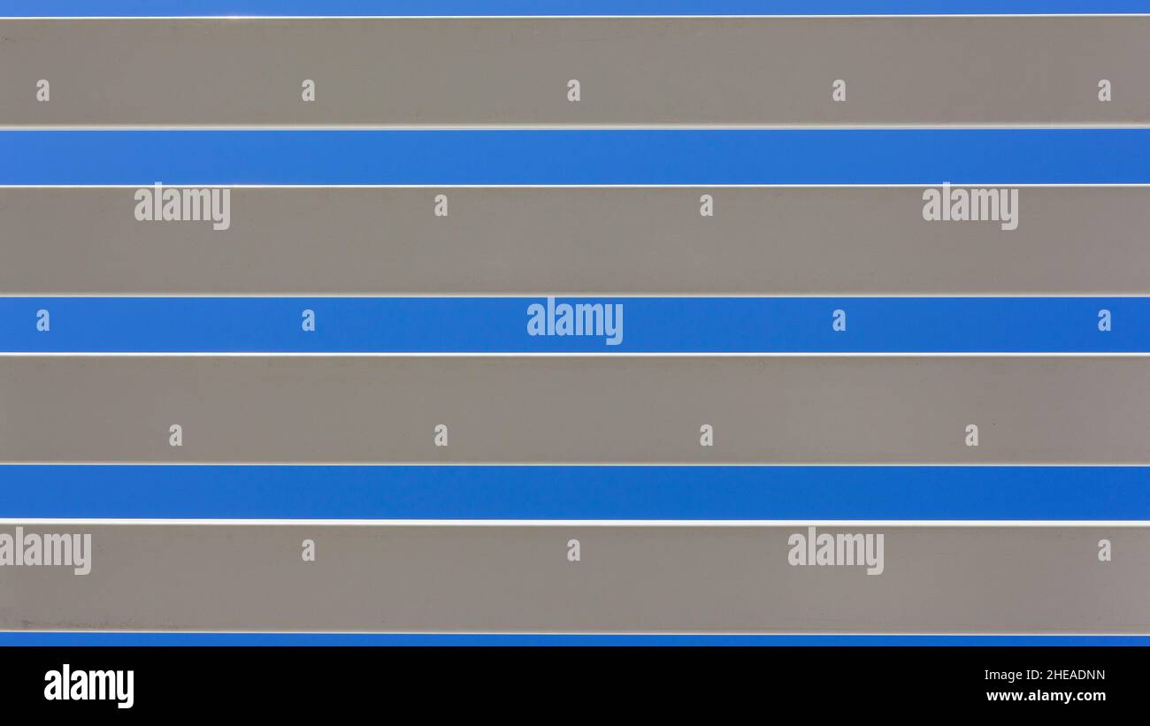 White long plastic slats closeup against blue sky outdoor home awning ...