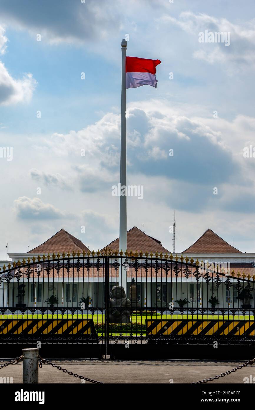 government building with the flag of the Indonesian state in the yard ...
