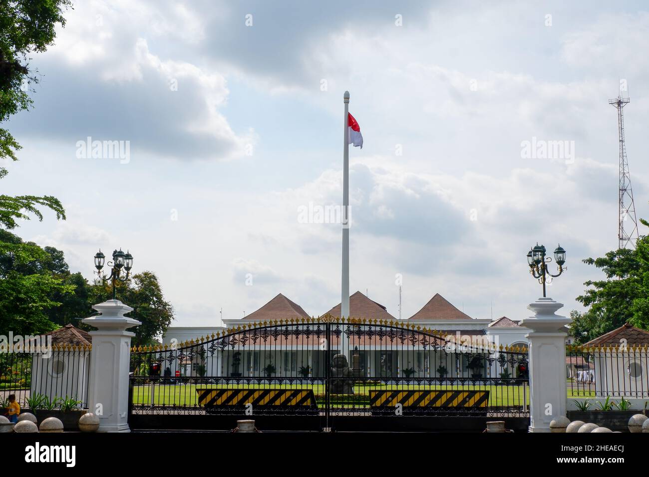 government building with the flag of the Indonesian state in the yard ...