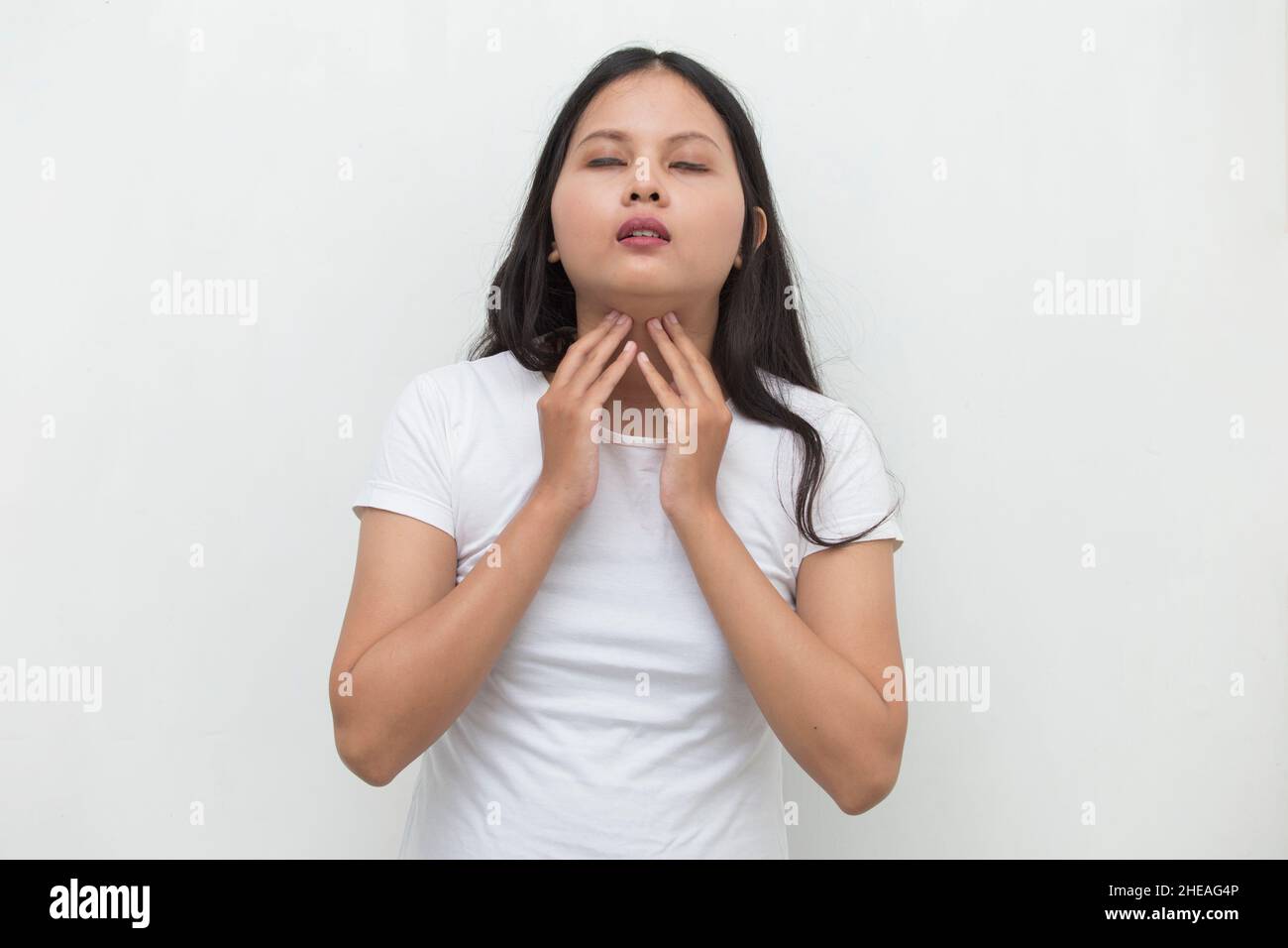 Asian woman with sore throat touching her neck.Sore throat sick.girl ...