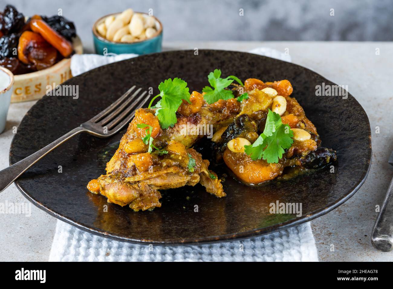 Chicken leg tagine with caramelised prunes and apricots and roasted ...