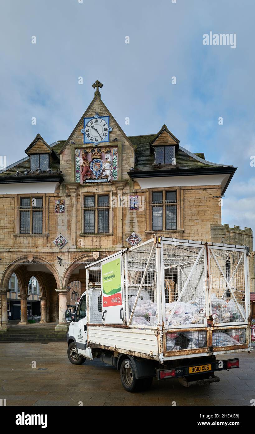 A van, collecting rubbish for recycling, parked in front of the ...