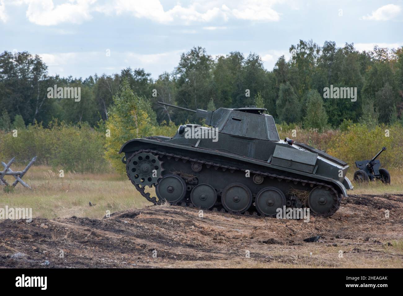 Attack of the Soviet tank T25. Tank moving through the fortification ...