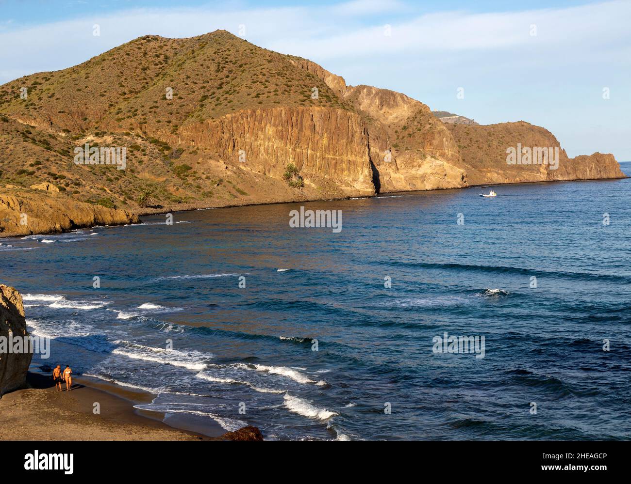 Man and woman holding hands walking on beach, Isleta del Moro, Cabo de ...