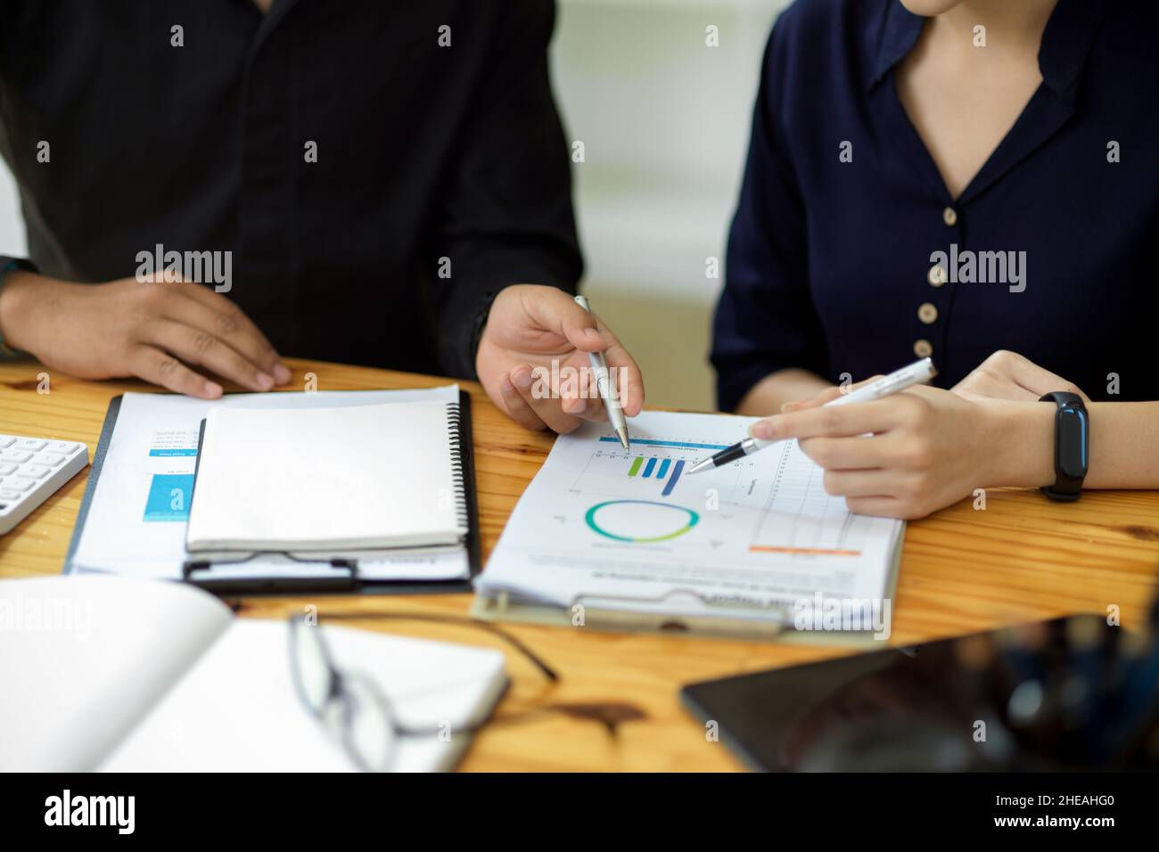 Professional financial male manager training his financial staff to ...