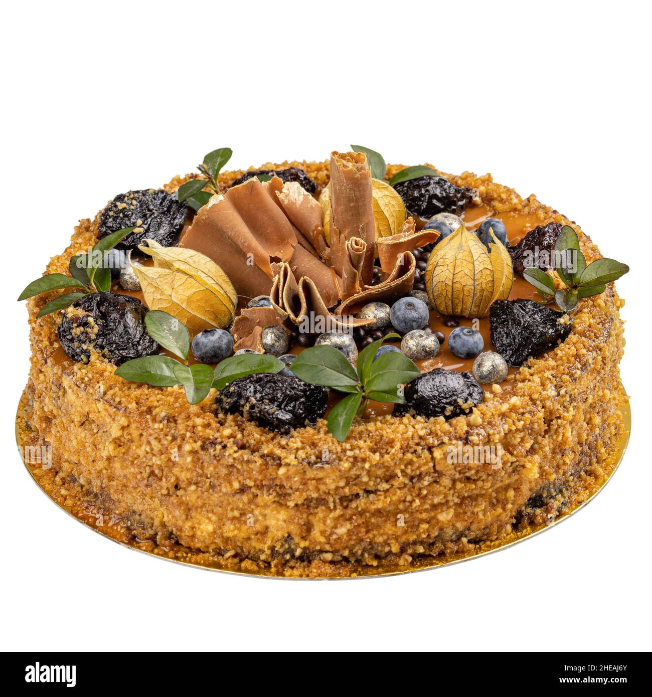 Festive cake with nuts and salted caramel topping decorated with dried ...