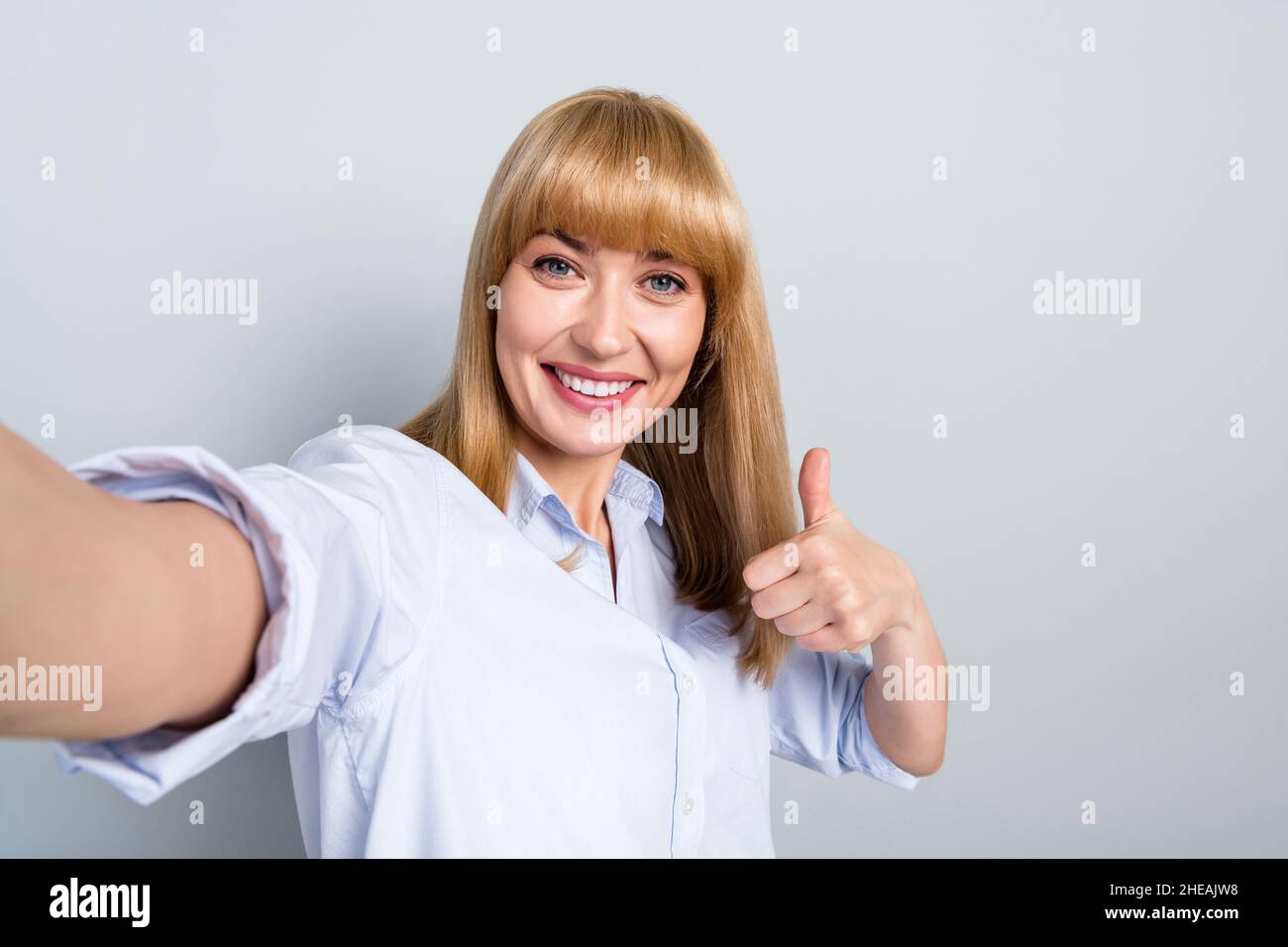 Self Portrait Of Attractive Cheerful Girl Employer Showing Thumbup Ad Advert Isolated Over Grey 