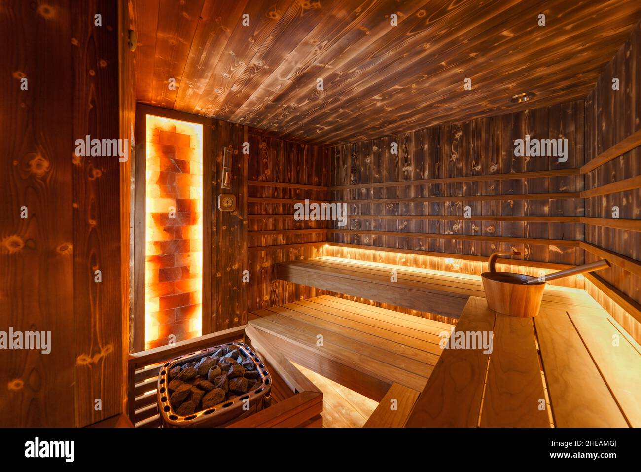 Empty wooden steam room with stone heater Stock Photo - Alamy