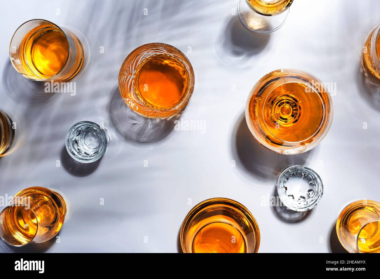 Strong drinks, spirits and distillates in glasses: cognac, grappa ...