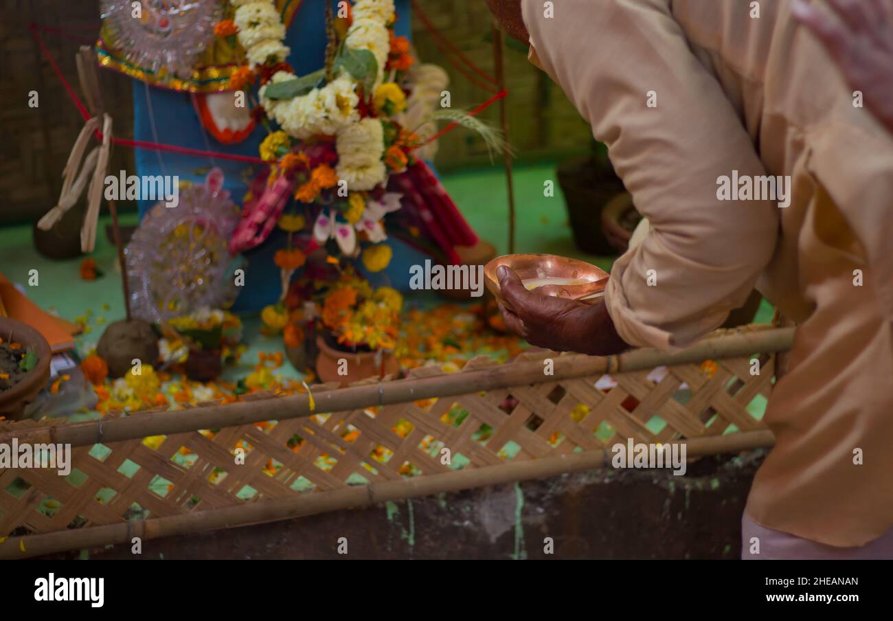 saraswati puja festival rituals being performed by priest. idol of ...