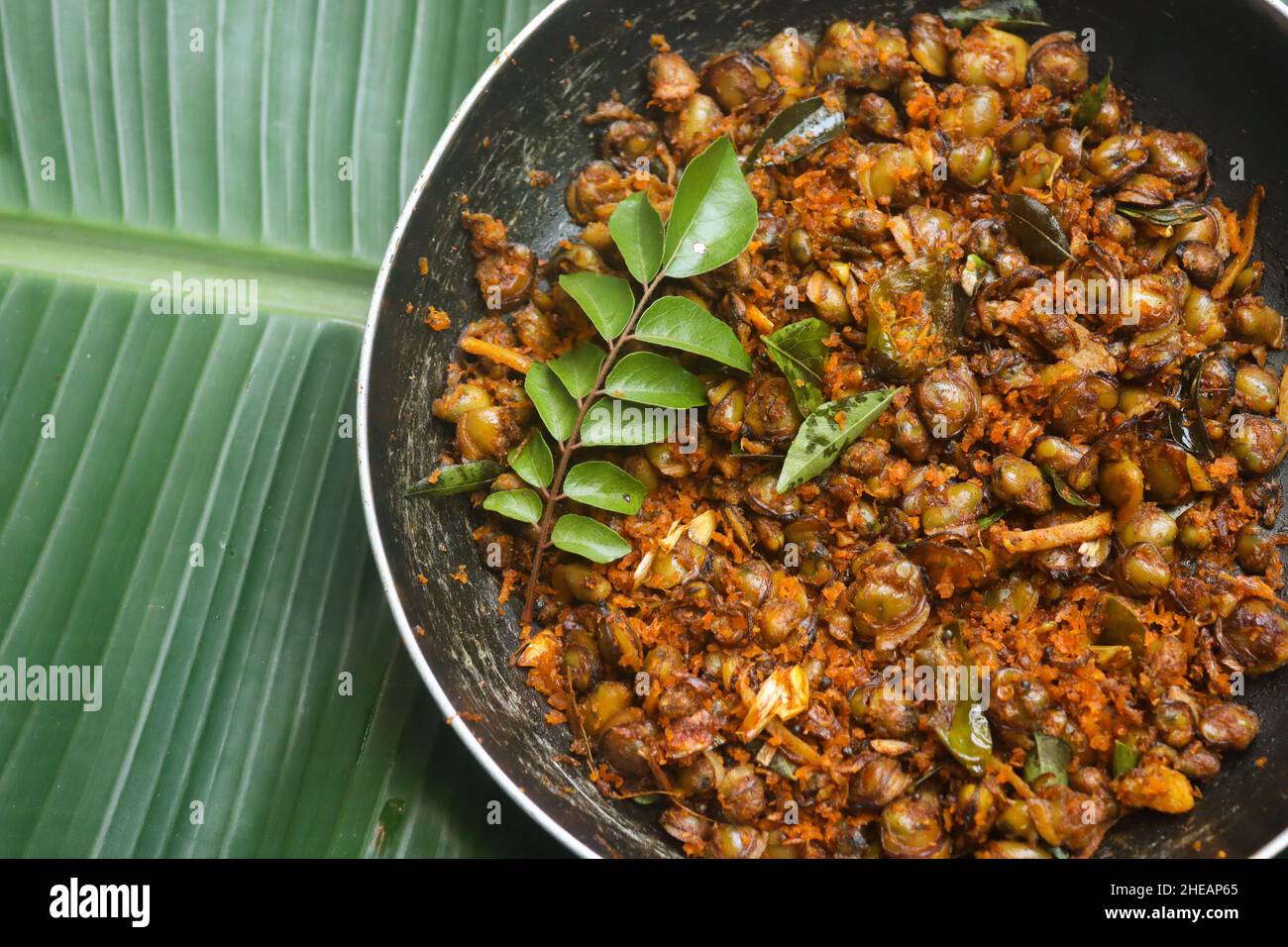 Clam meat fry kerala style kakka irachi fry Stock Photo - Alamy