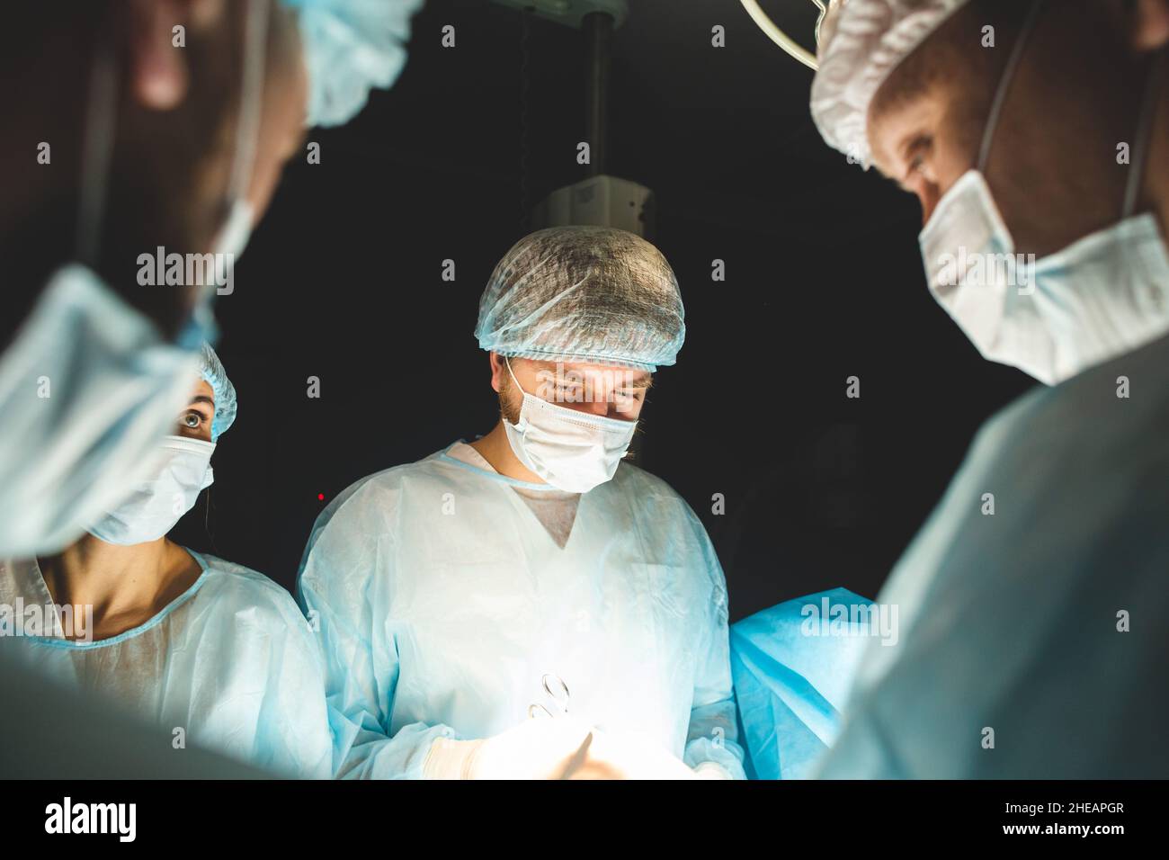 The senior surgeon in the operating room, where the patient is waiting ...