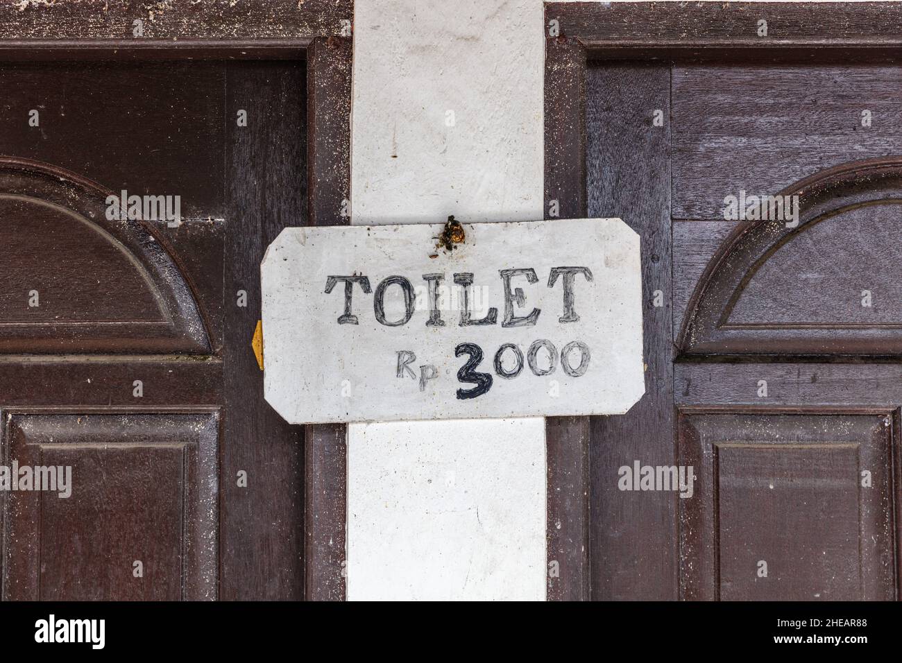 Handwritten cardboard sign TOILET on the wall of a public toilets in ...