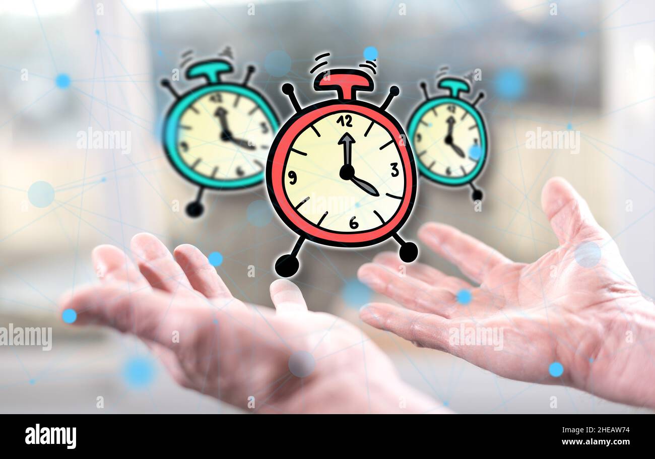 Time concept above the hands of a man Stock Photo - Alamy