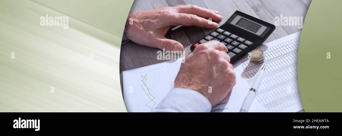 Hands of an accountant working on financial documents and using a ...