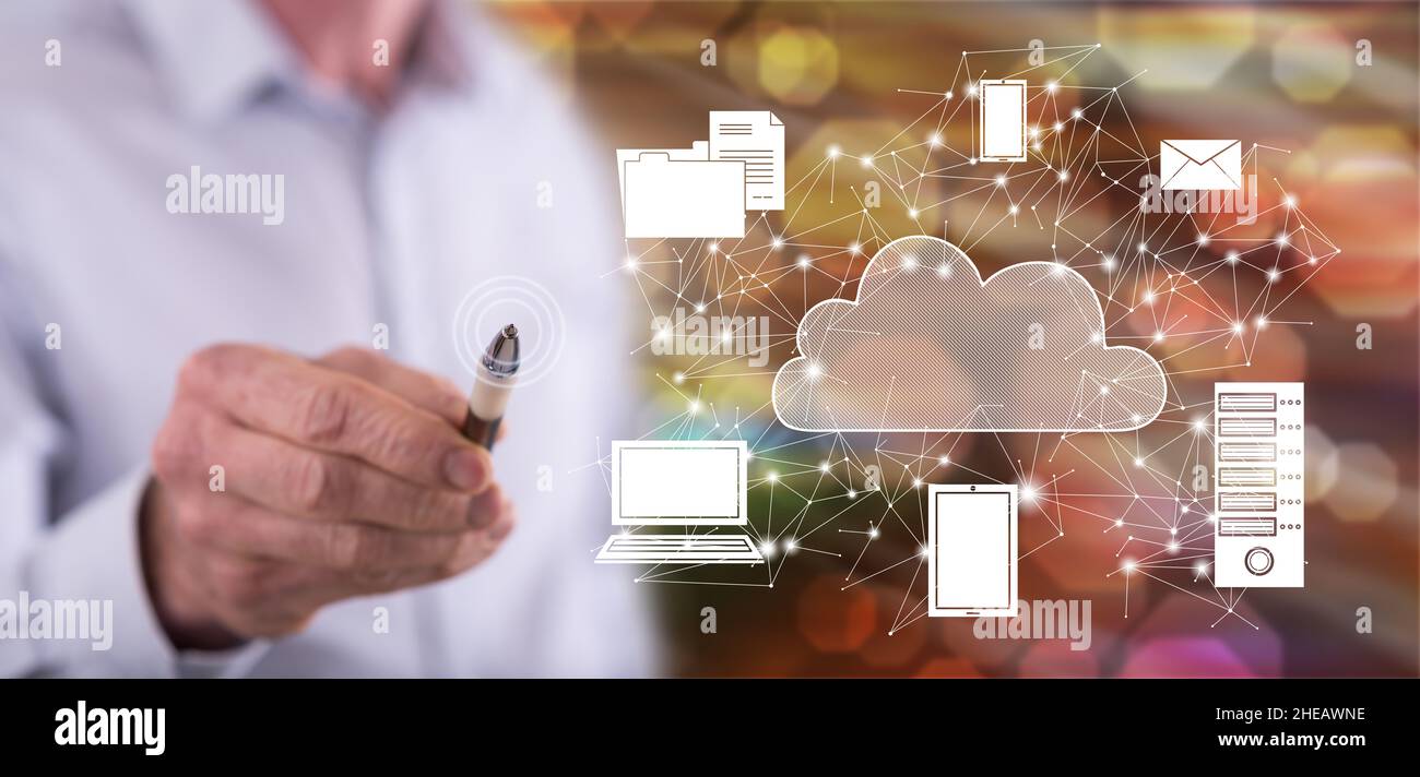 Man touching a cloud computing concept on a touch screen with a pen ...
