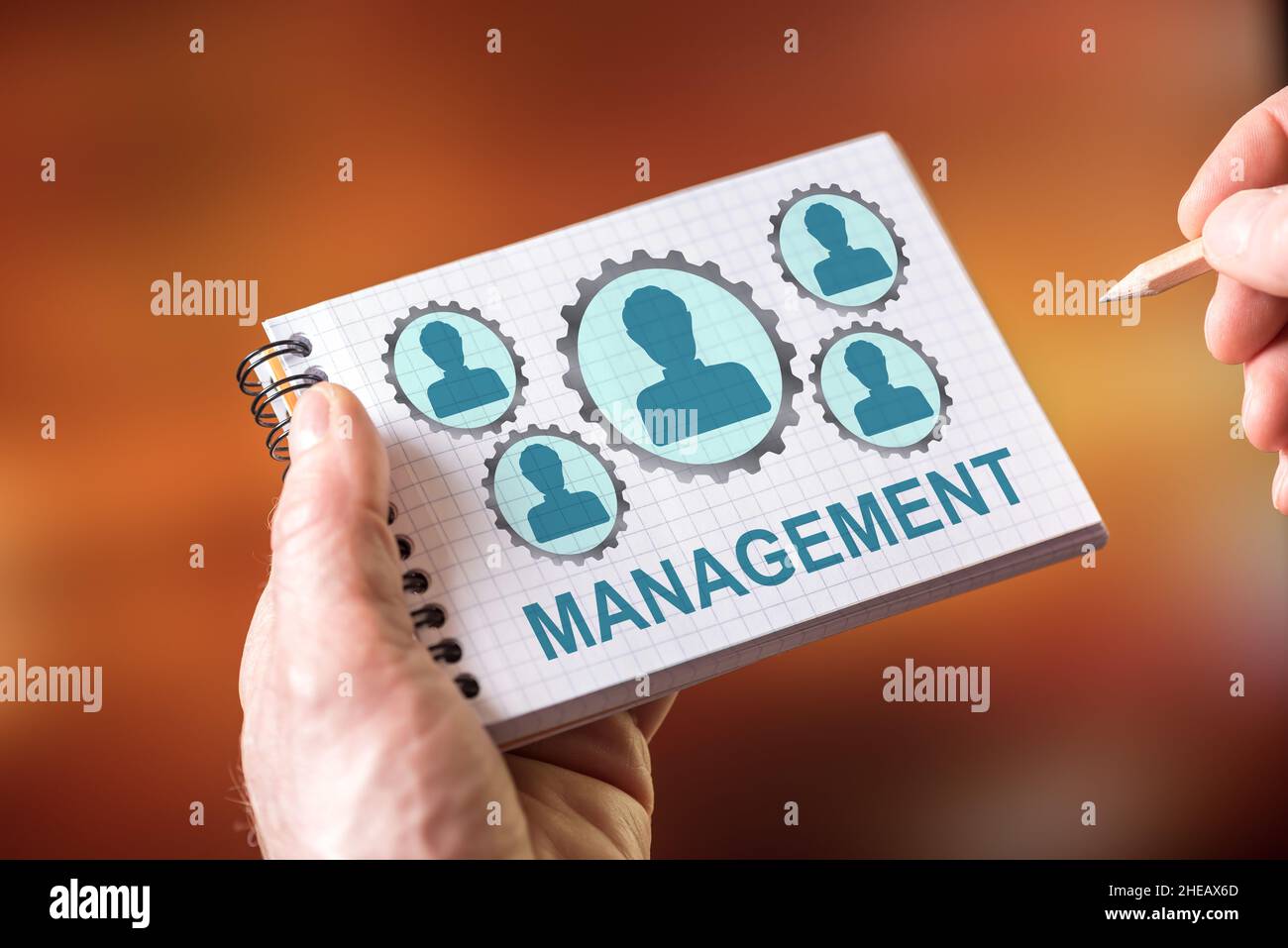 Hand drawing management concept on a notepad Stock Photo - Alamy