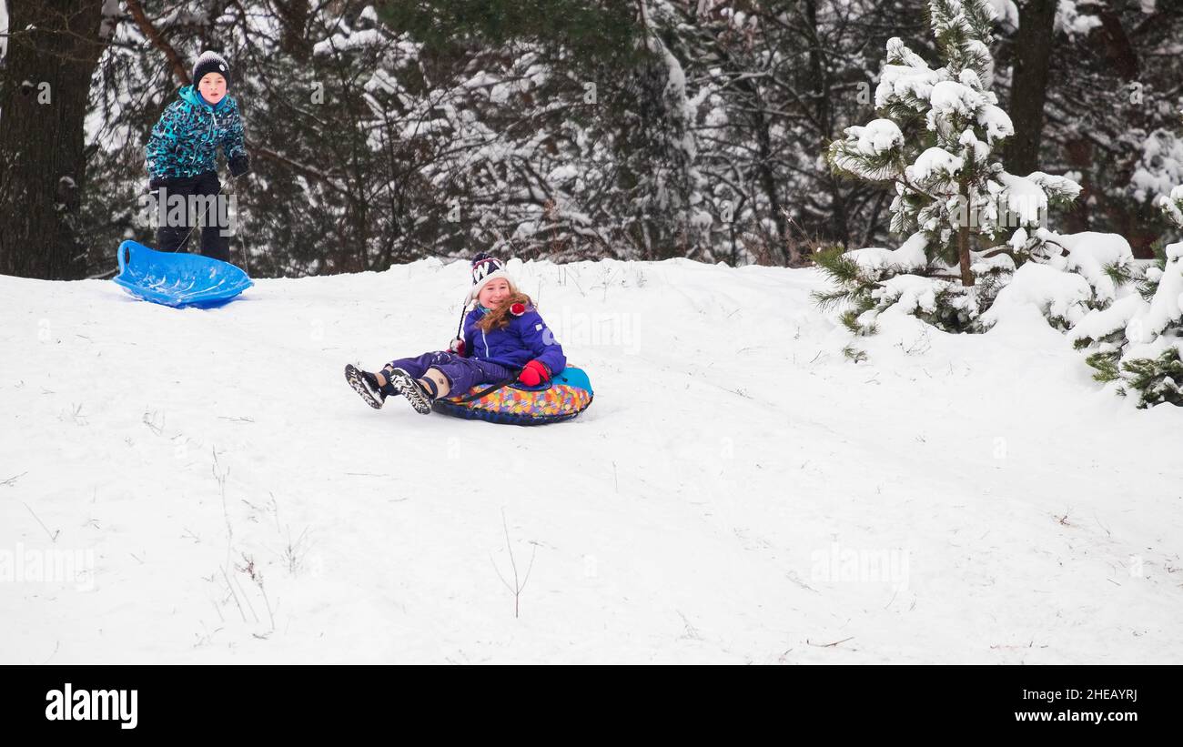 Children playing on a sled hi-res stock photography and images - Alamy