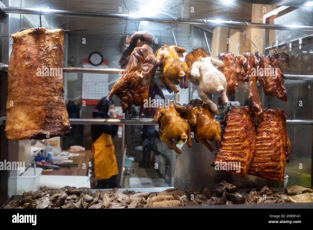 Chinese restaurant window with crispy ducks and ribs hanging in the ...