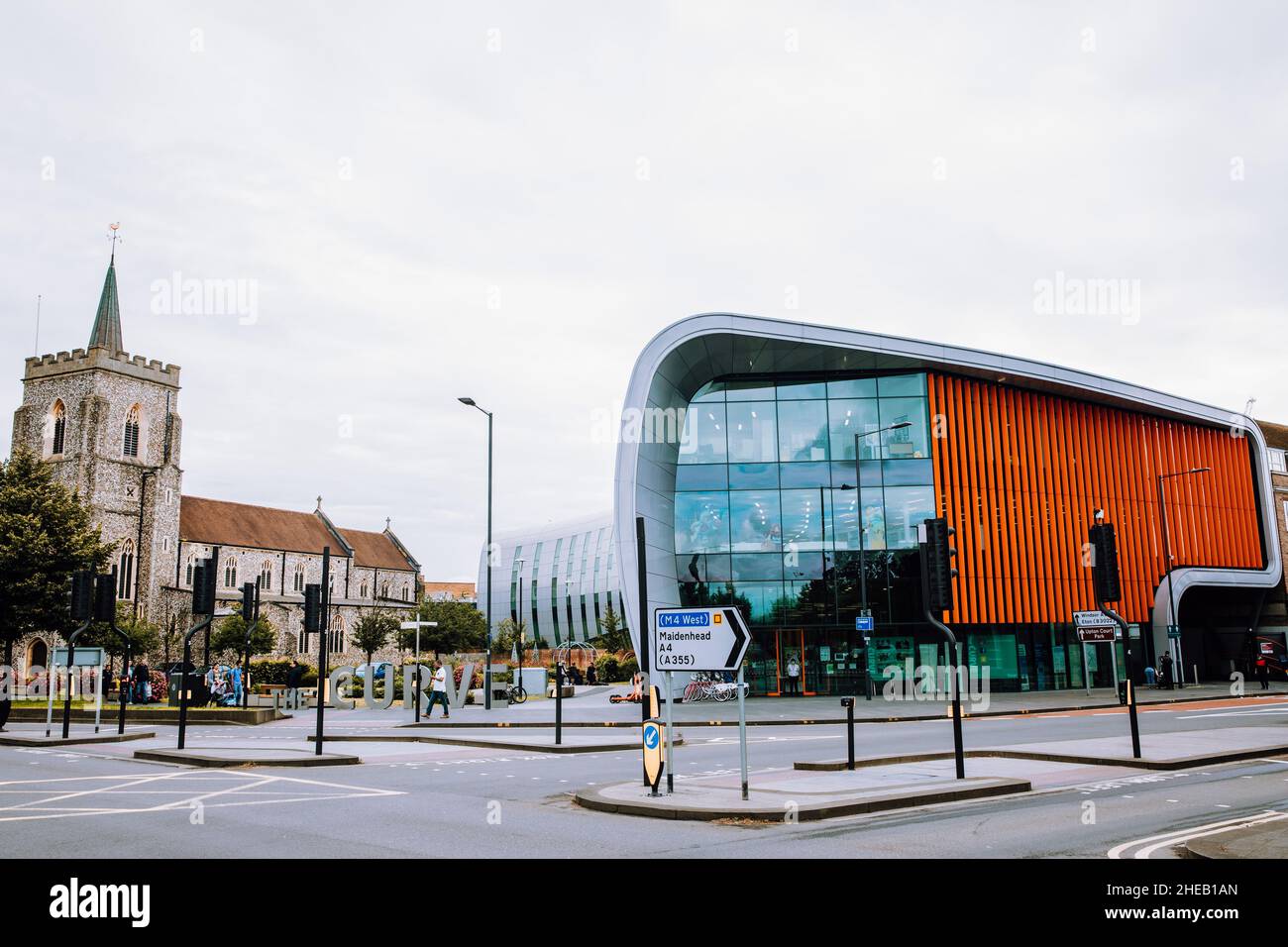 Slough, UK. 10th July, 2021. St Ethelbert's church and the Curve are ...