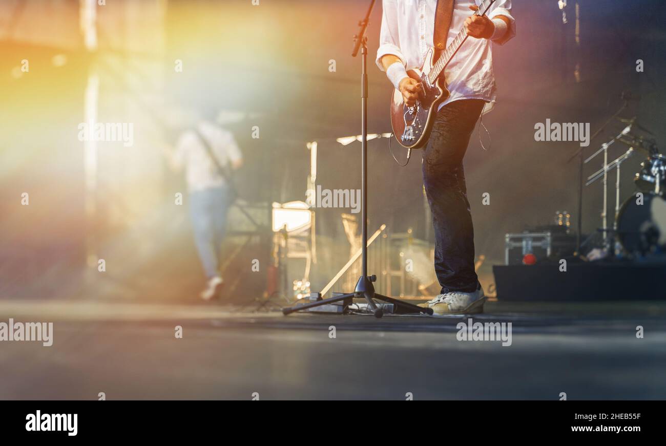 Guitarist playing solo on the live musical concert Stock Photo - Alamy