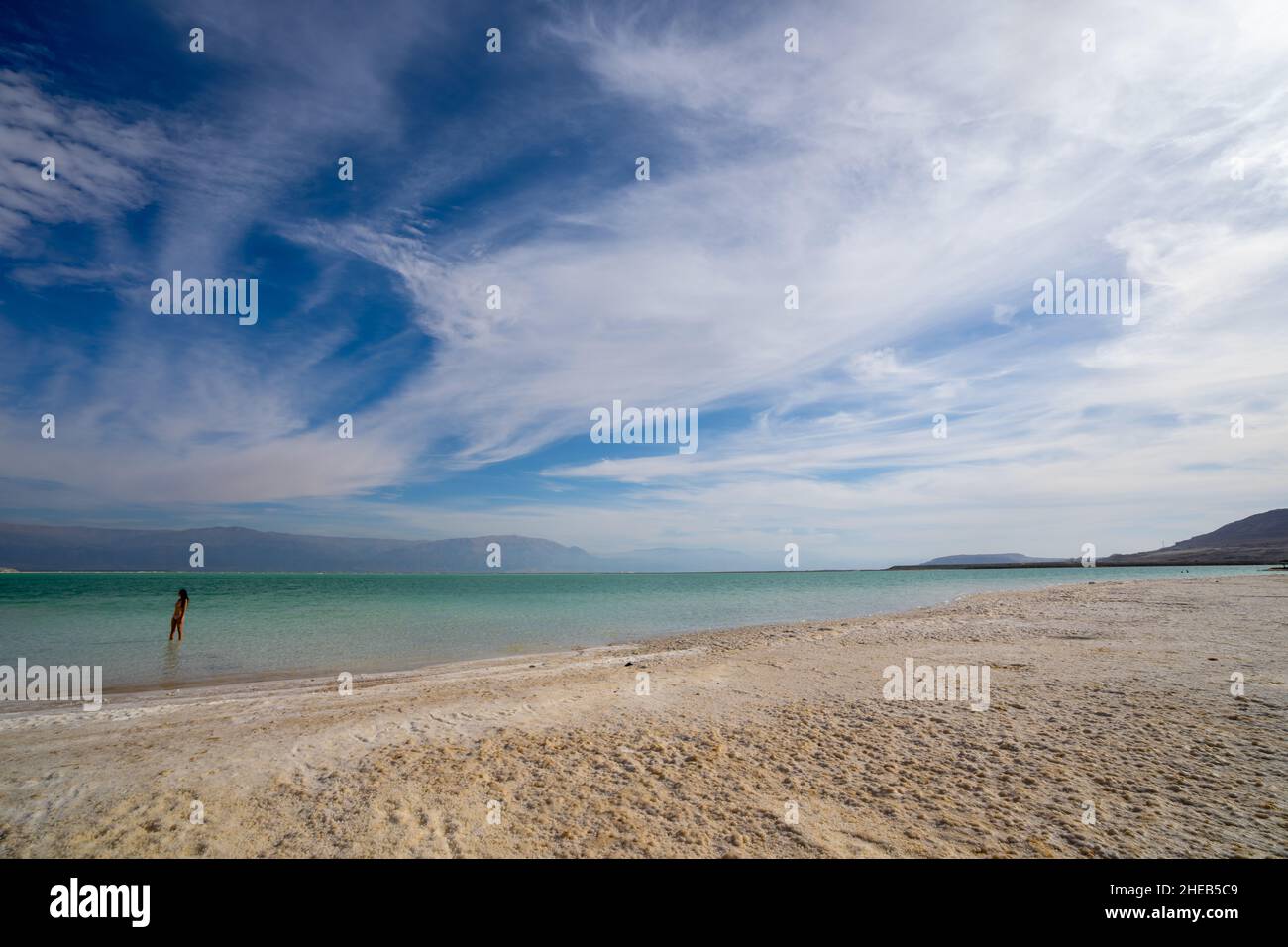 water level receding and salt crystallization due to evaporation on the ...