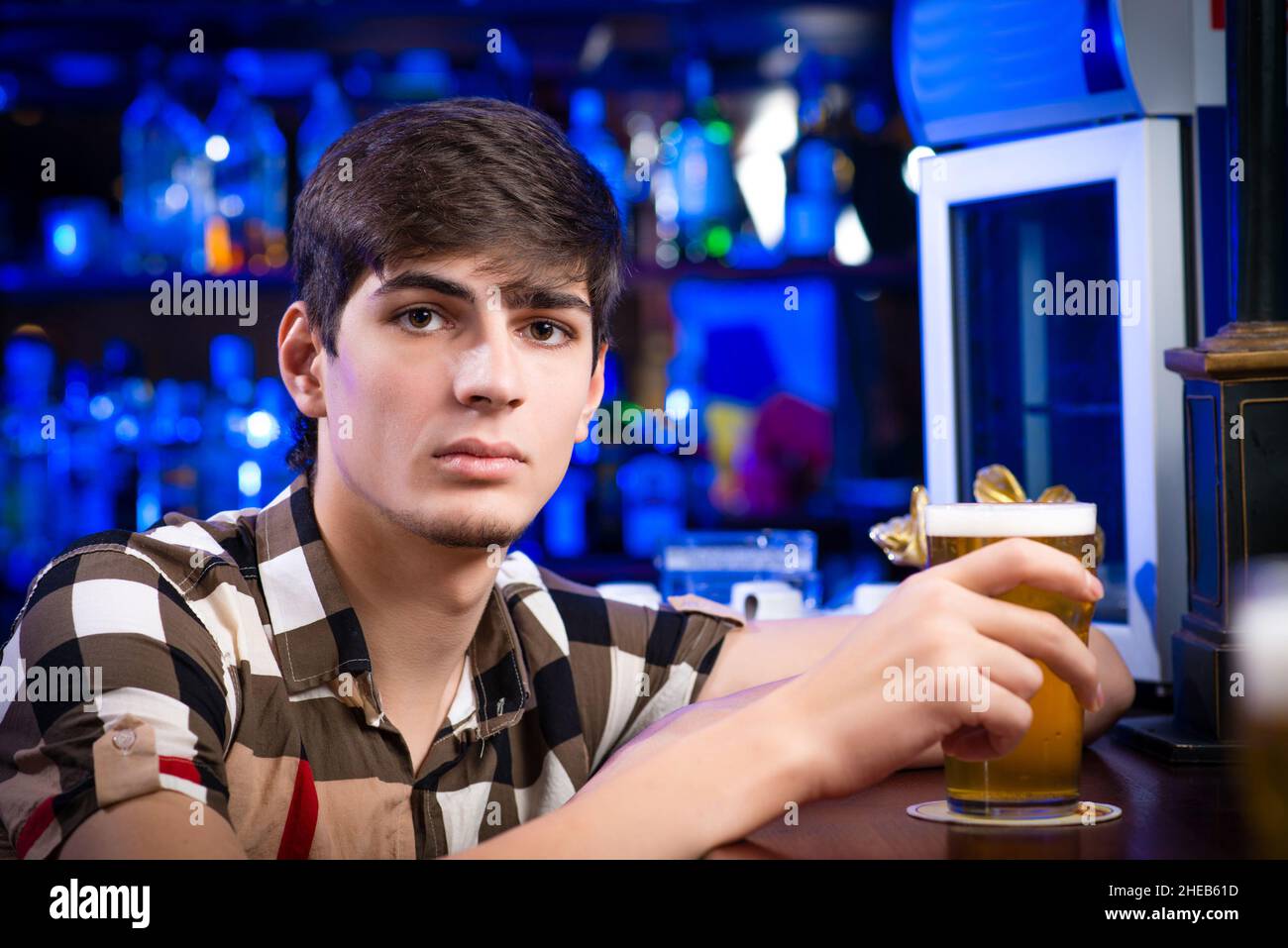 portrait of a young man at the bar Stock Photo - Alamy