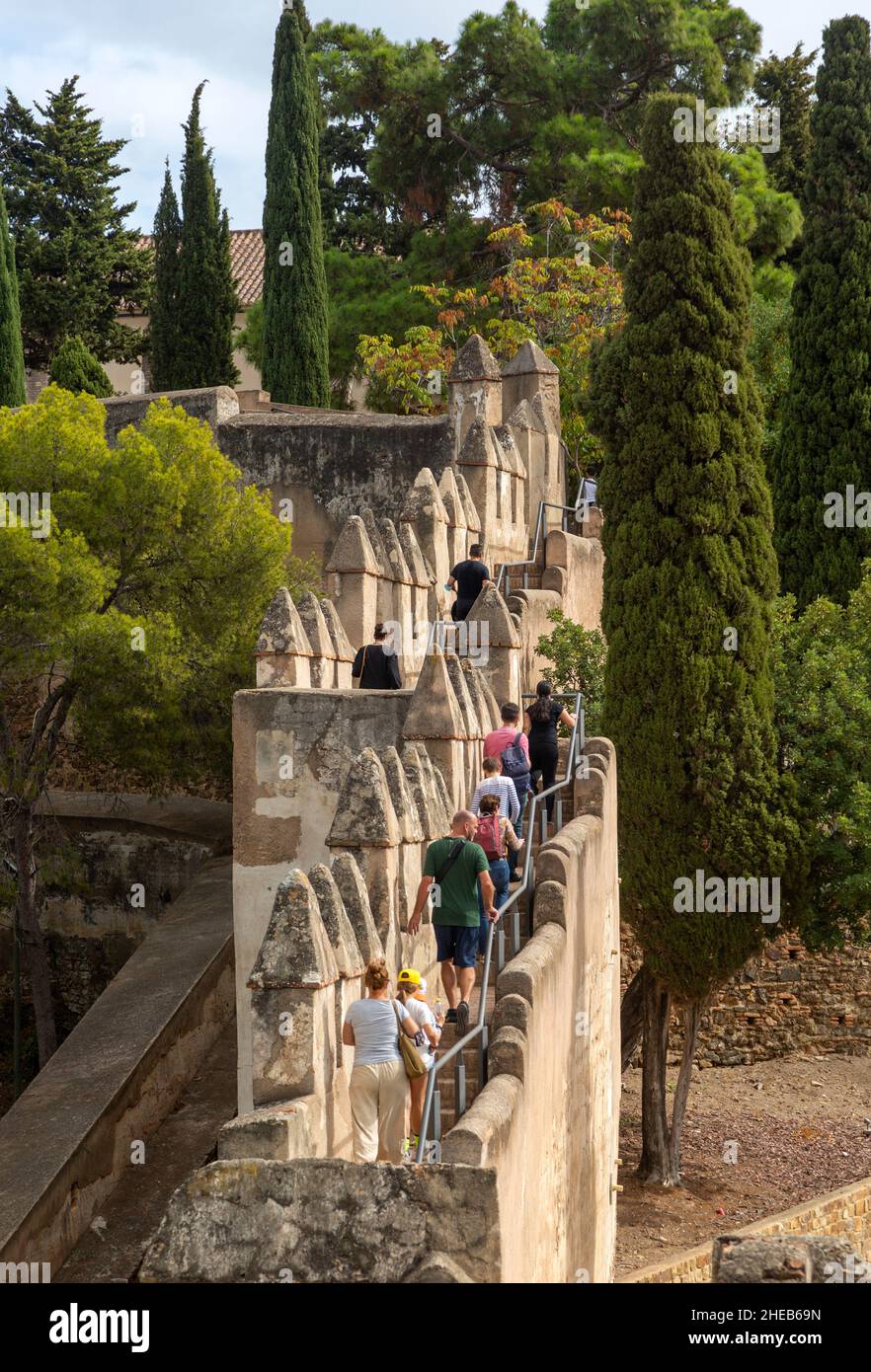 People exploring the defensive ramparts Castillo de Gibralfaro castle ...