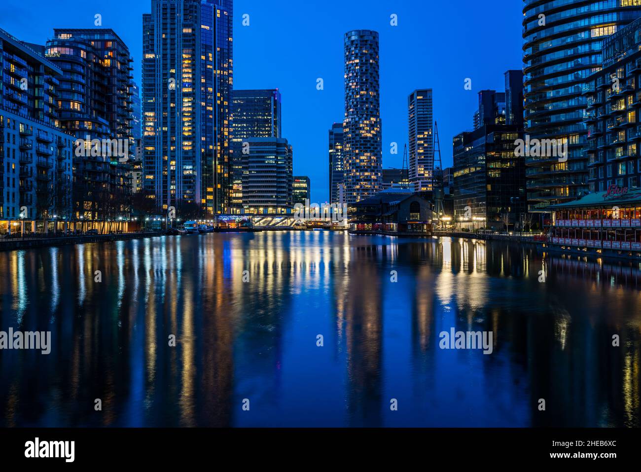 Evening view of modern skyscrapers across Millwall Inner Dock in Canary ...