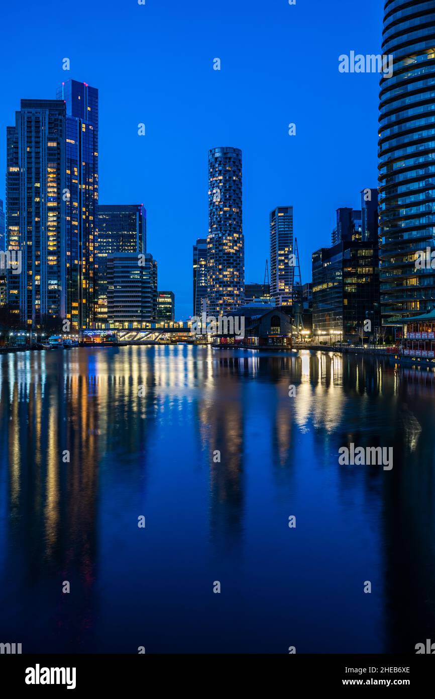 Evening view of modern skyscrapers across Millwall Inner Dock in Canary ...